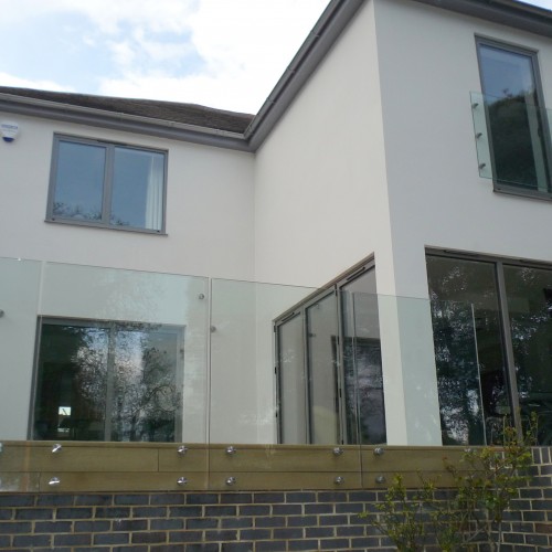 Frameless Side-Fixed Glass Balustrade | UK Staircase - Dio-Met