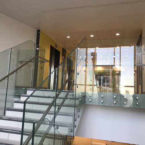 Frameless Side-Fixed Glass Balustrade | UK Staircase - Dio-Met