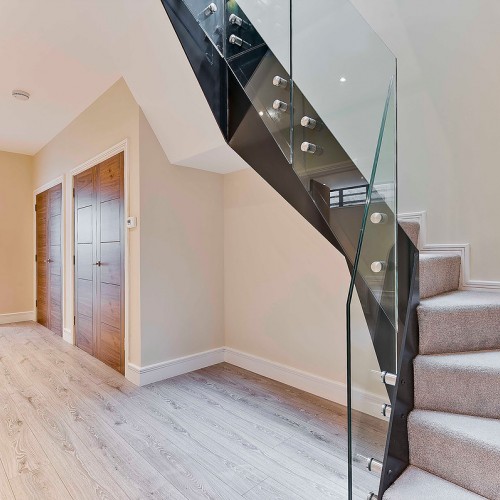 Frameless Side-Fixed Glass Balustrade | UK Staircase - Dio-Met