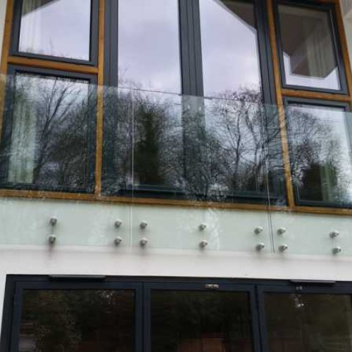 Frameless Side-Fixed Glass Balustrade | UK Staircase - Dio-Met