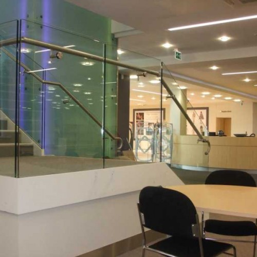 Offset glass handrail bracket