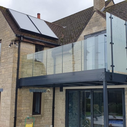 Infinity Frameless Walkout Balcony | UK Custom - Dio-Met